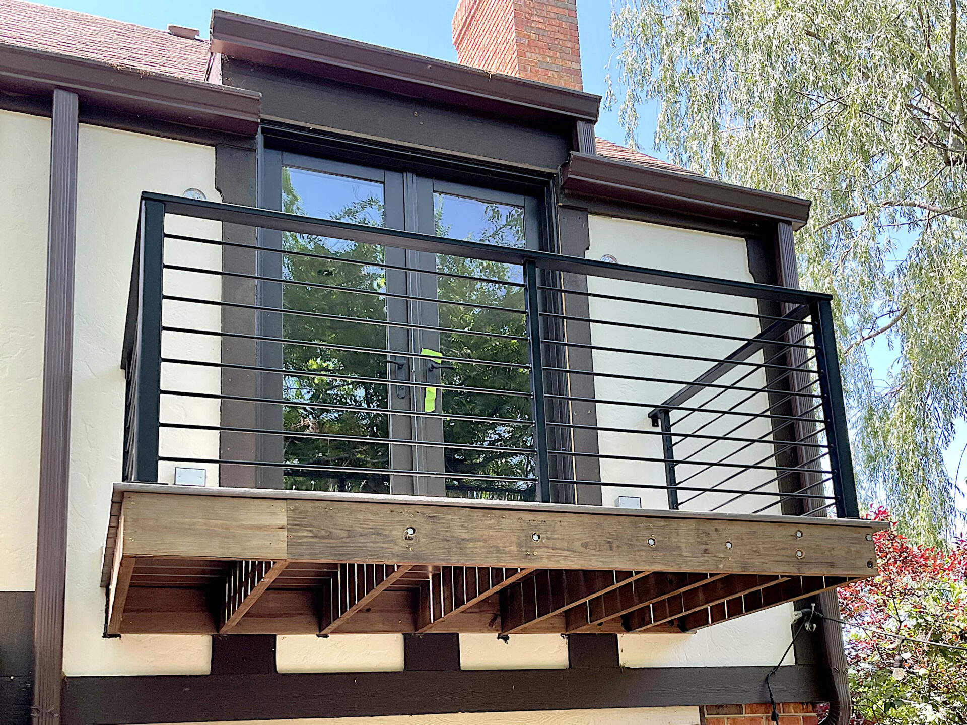 Traditional wrought iron balconies painted satin black in Oak Park ...