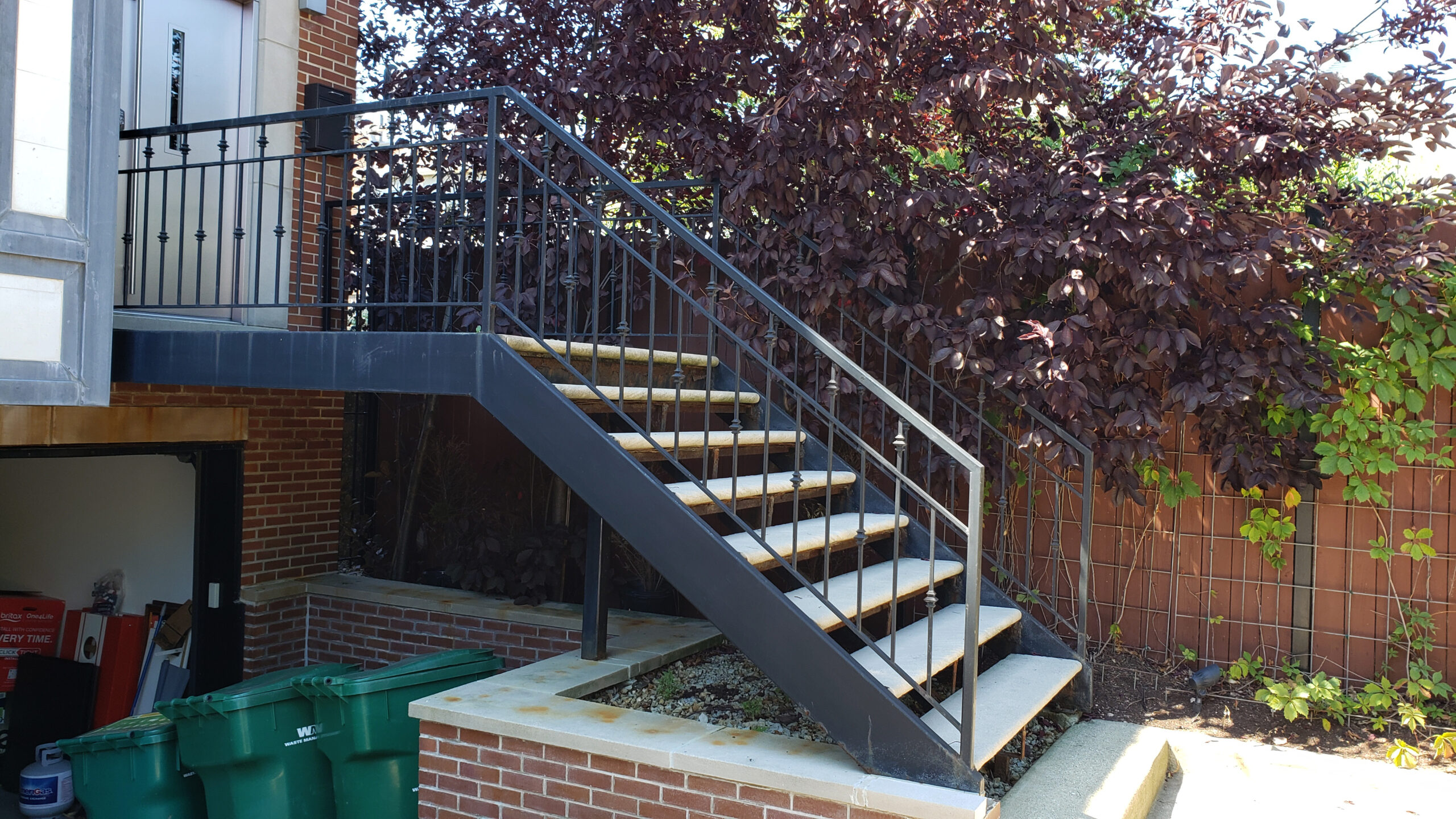 Modern wrought iron & concrete stairs painted satin black in Chicago ...