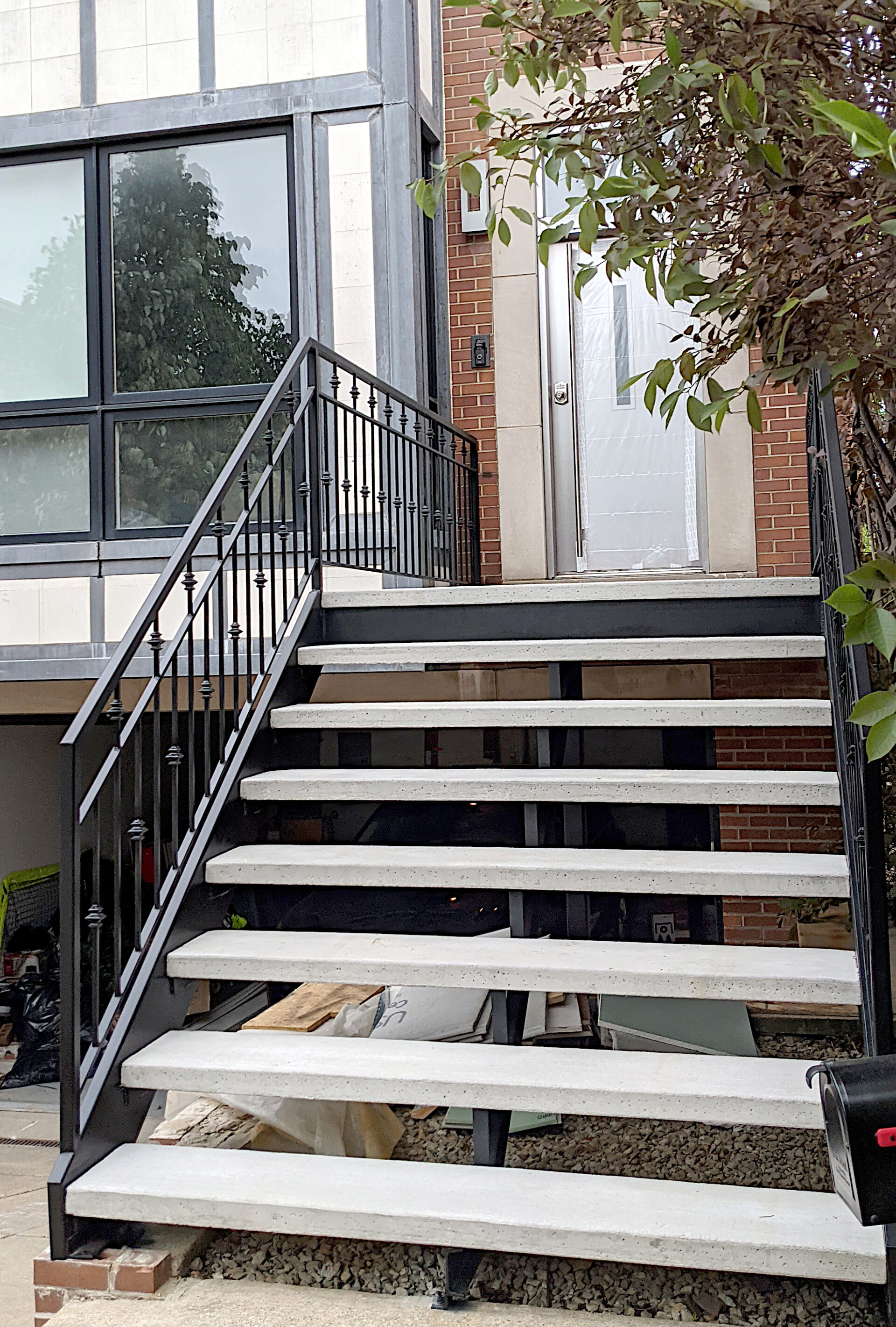 Modern wrought iron & concrete stairs painted satin black in Chicago ...