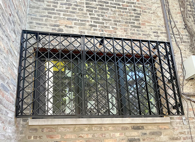 Traditional wrought iron window guards painted satin black in Greenbay ...