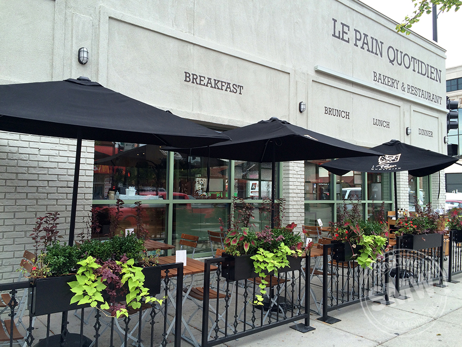 Le Pain Quotidien restaurant outdoor sidewalk railing with flower boxes ...