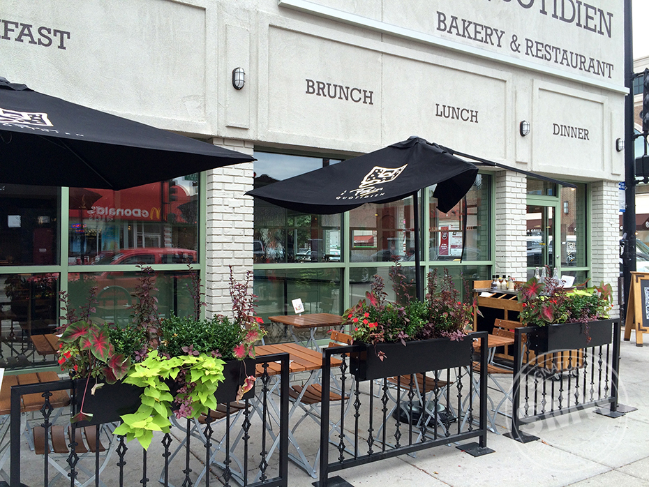 Le Pain Quotidien restaurant outdoor sidewalk railing with flower boxes ...