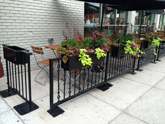 Le Pain Quotidien restaurant outdoor sidewalk railing with flower boxes ...