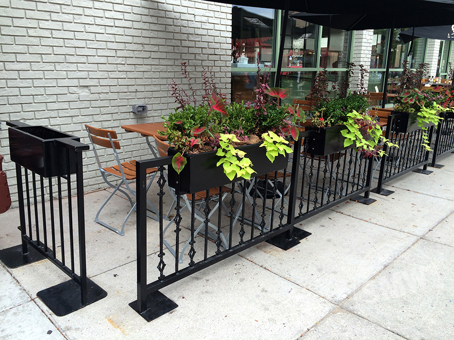 Le Pain Quotidien restaurant outdoor sidewalk railing with flower boxes ...